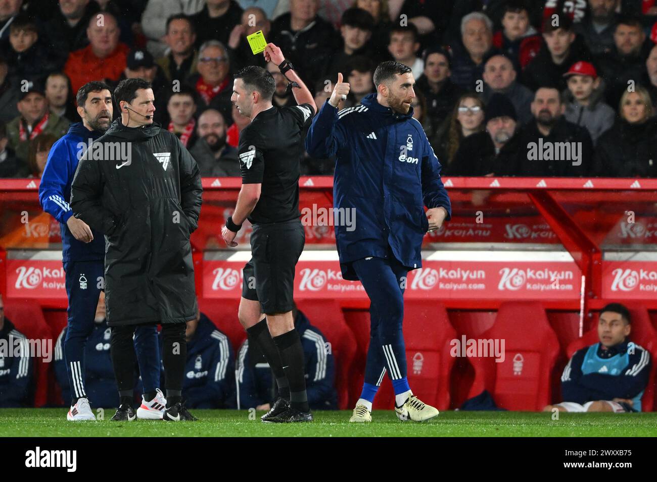 Referee, Michael Oliver shows a yellow card to Matt Turner of ...