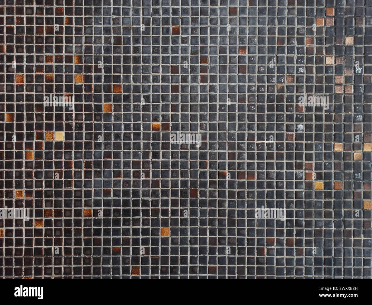 Texture of old brown, black and orange wall tiles add character and ...