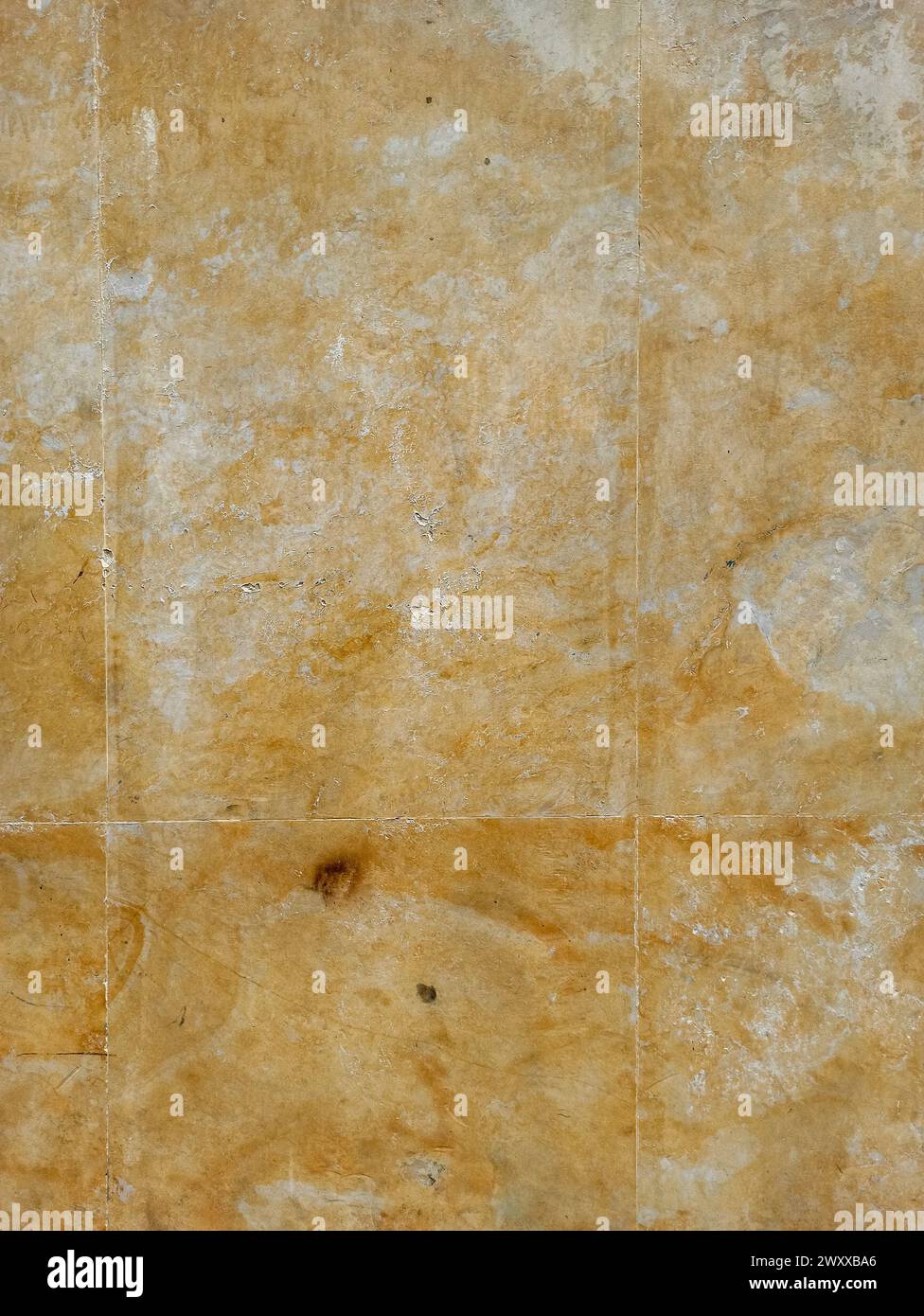 Texture of yellow marble with veins on the wall of an aged exterior ...
