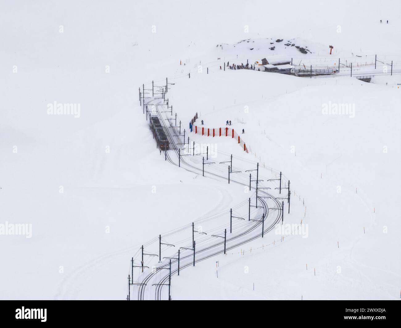 Aerial View of Snowy Zermatt Ski Resort with Train Track and Skiers ...