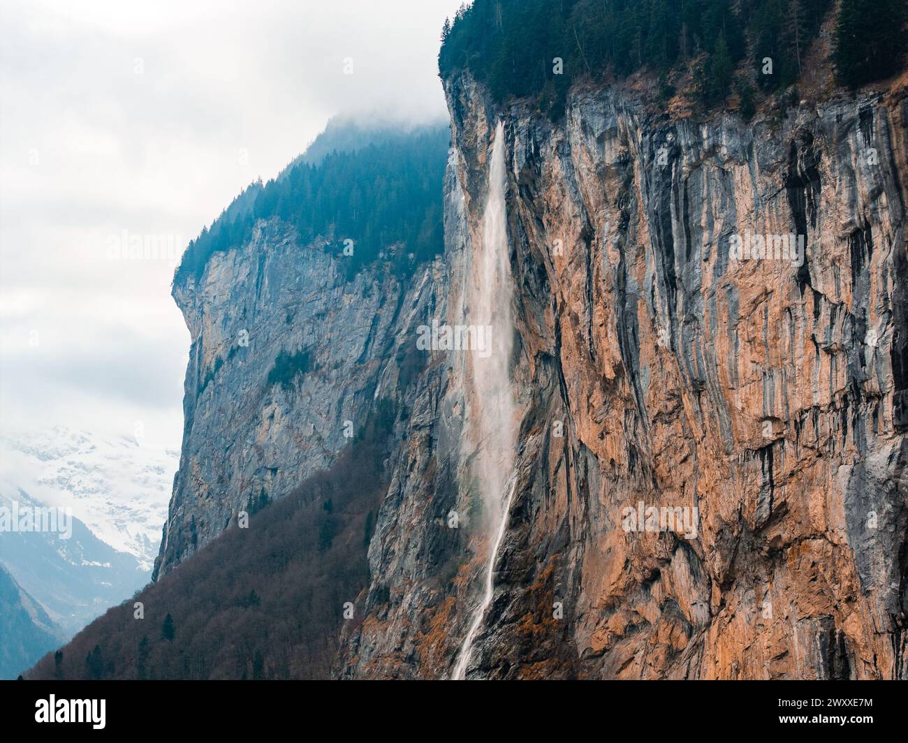Misty Waterfall and Rugged Cliffs in Murren, Switzerland's Alpine ...