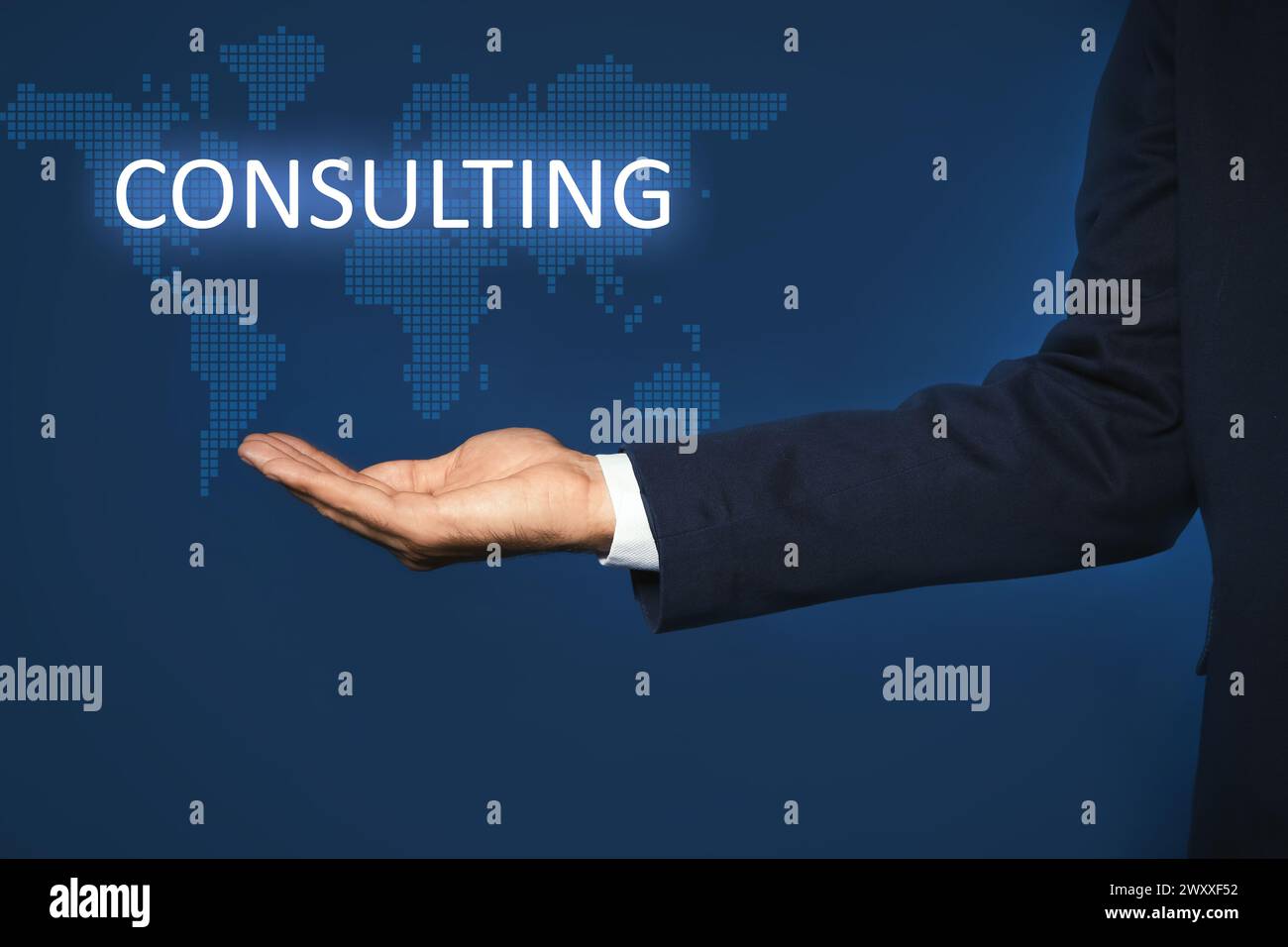 Consulting. Businessman holding virtual map on blue background, closeup ...