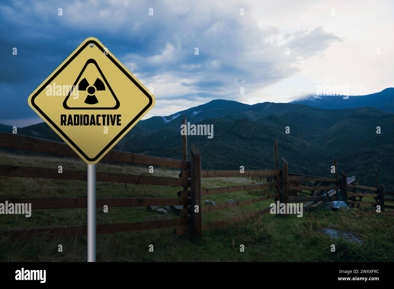 Radioactive pollution. Yellow warning sign with hazard symbol in ...