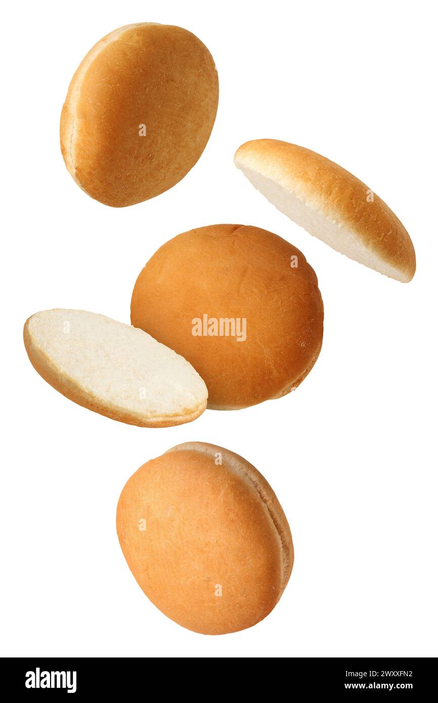 Fresh burger buns falling on white background Stock Photo - Alamy