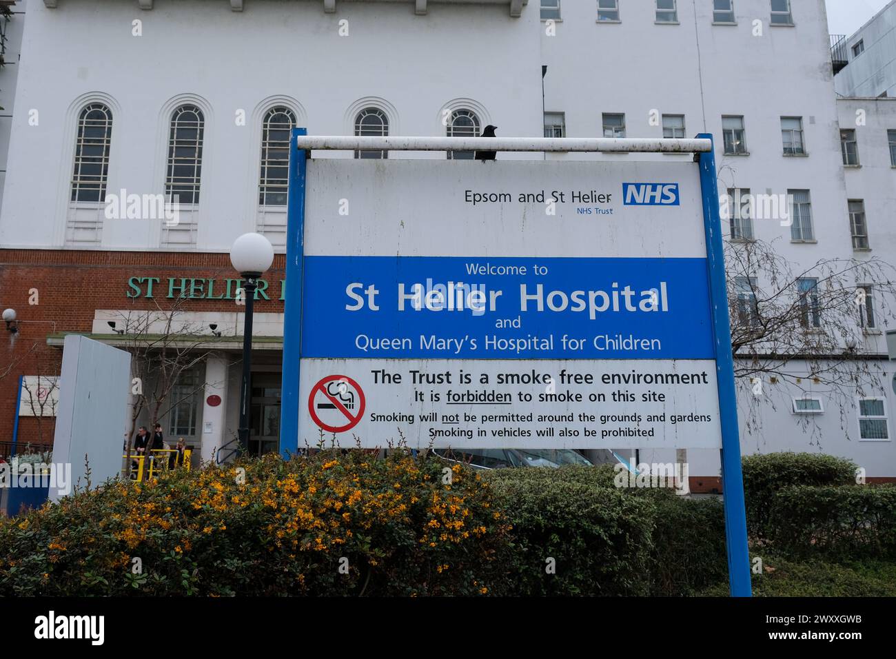 London, UK. A sign outside the St Helier Hospital and Queen Mary ...