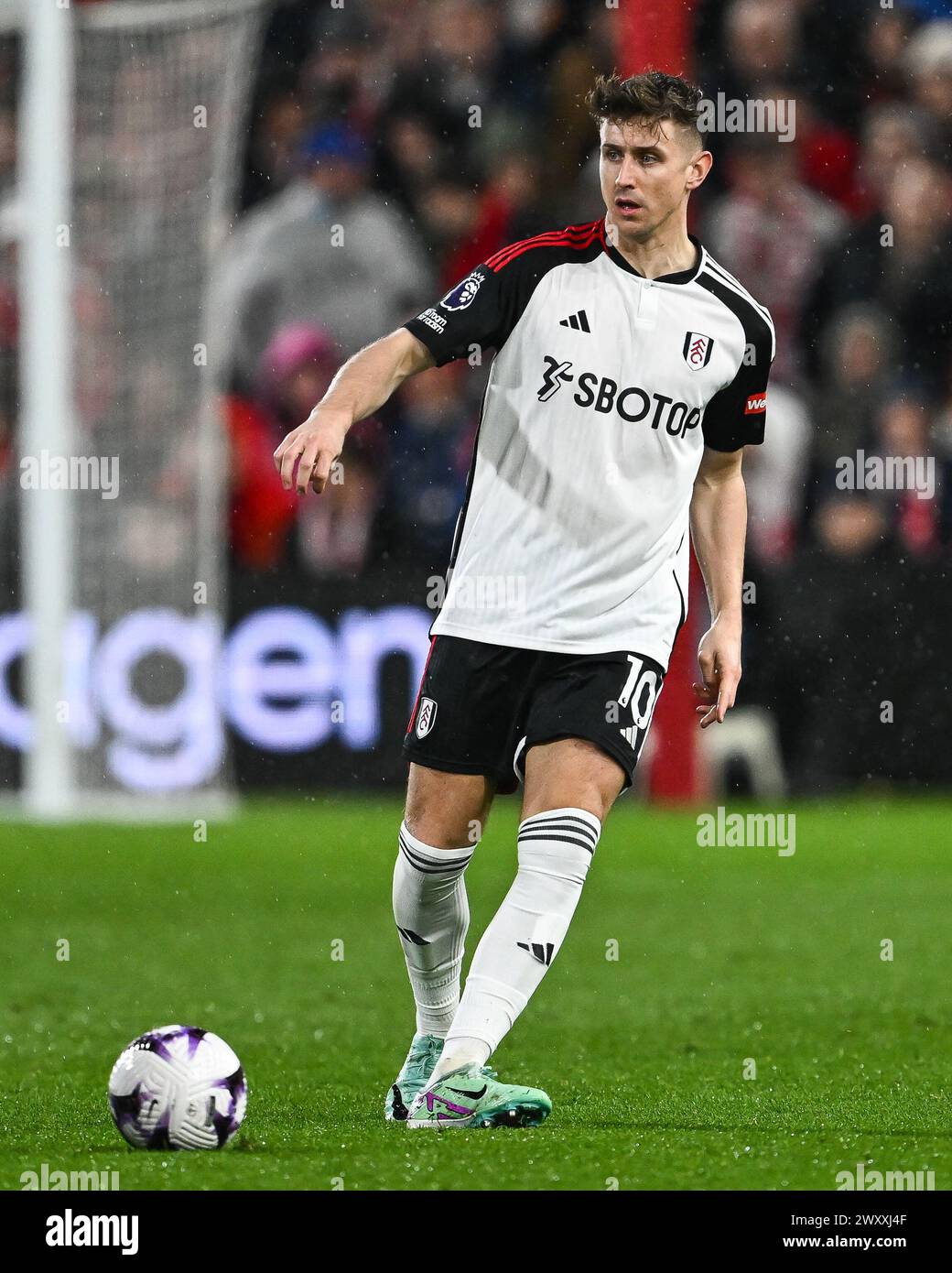 Tom Cairney of Fulham passes the ball during the Premier League match ...