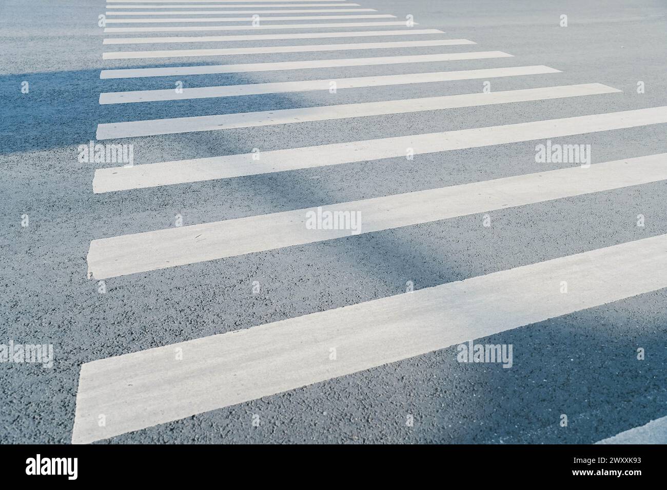 pedestrian crossing, white stripes on black asphalt, road markings ...