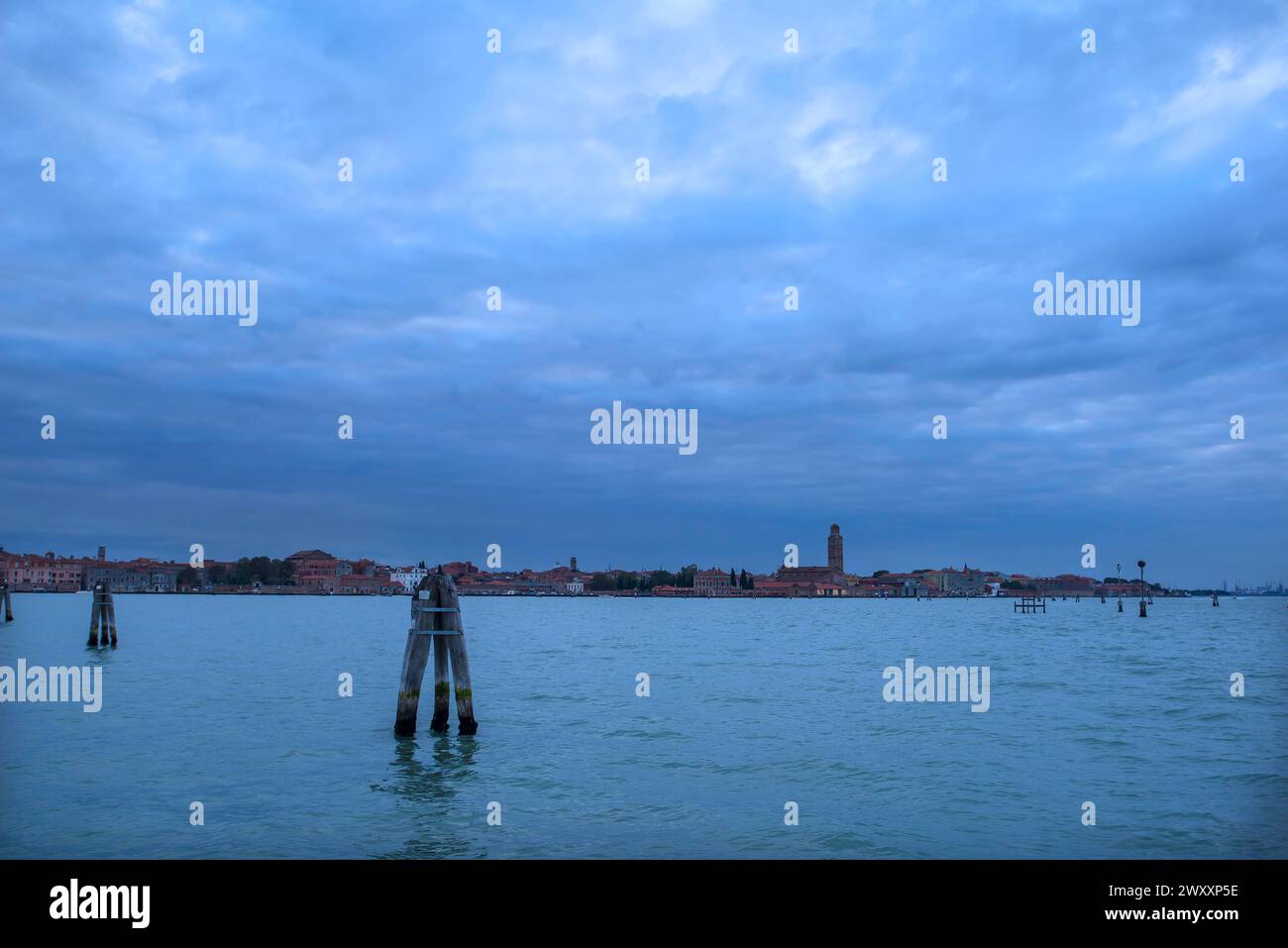 View of the island of Burano with the lighthouse in rainy weather ...