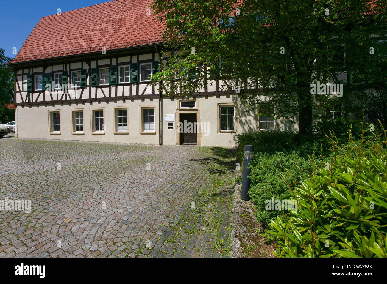 Building ensemble Muensingen Castle, today's vehicle registration ...