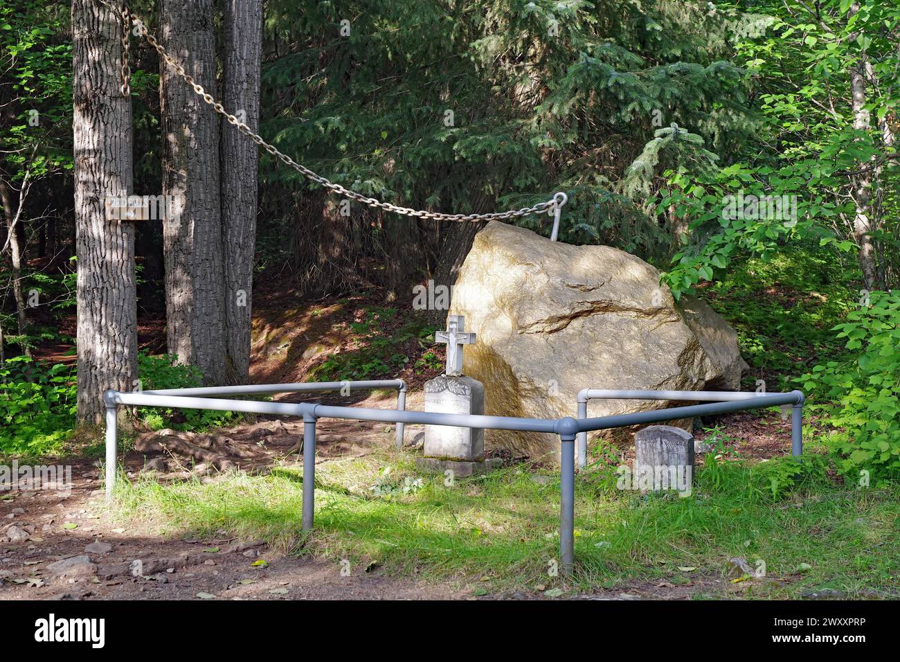 Gravestones and an imitation giant nugget at the old gold rush cemetery ...