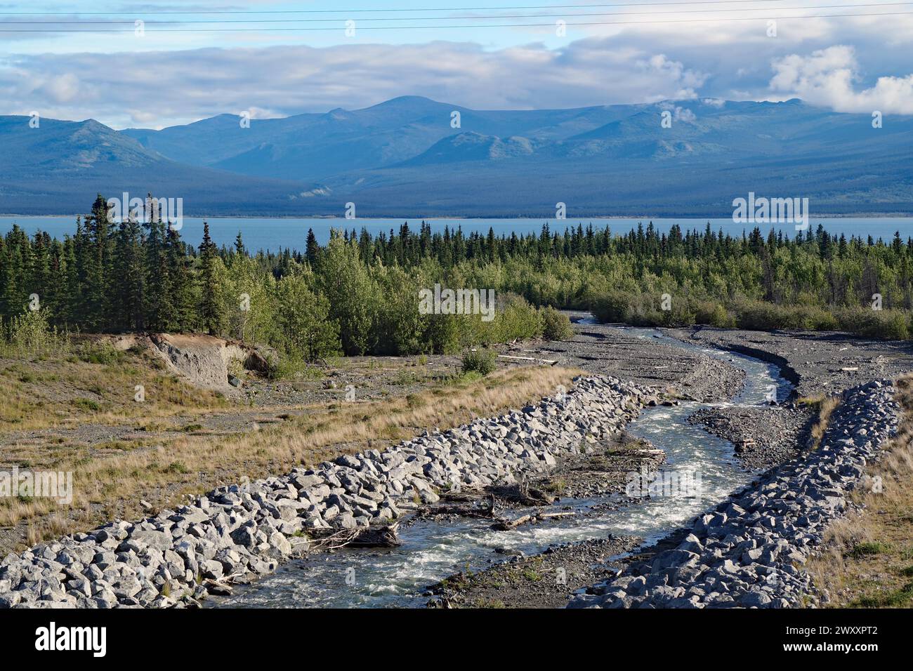 Stream leading down to Kluane Lake, mountains, wilderness, Alaska ...