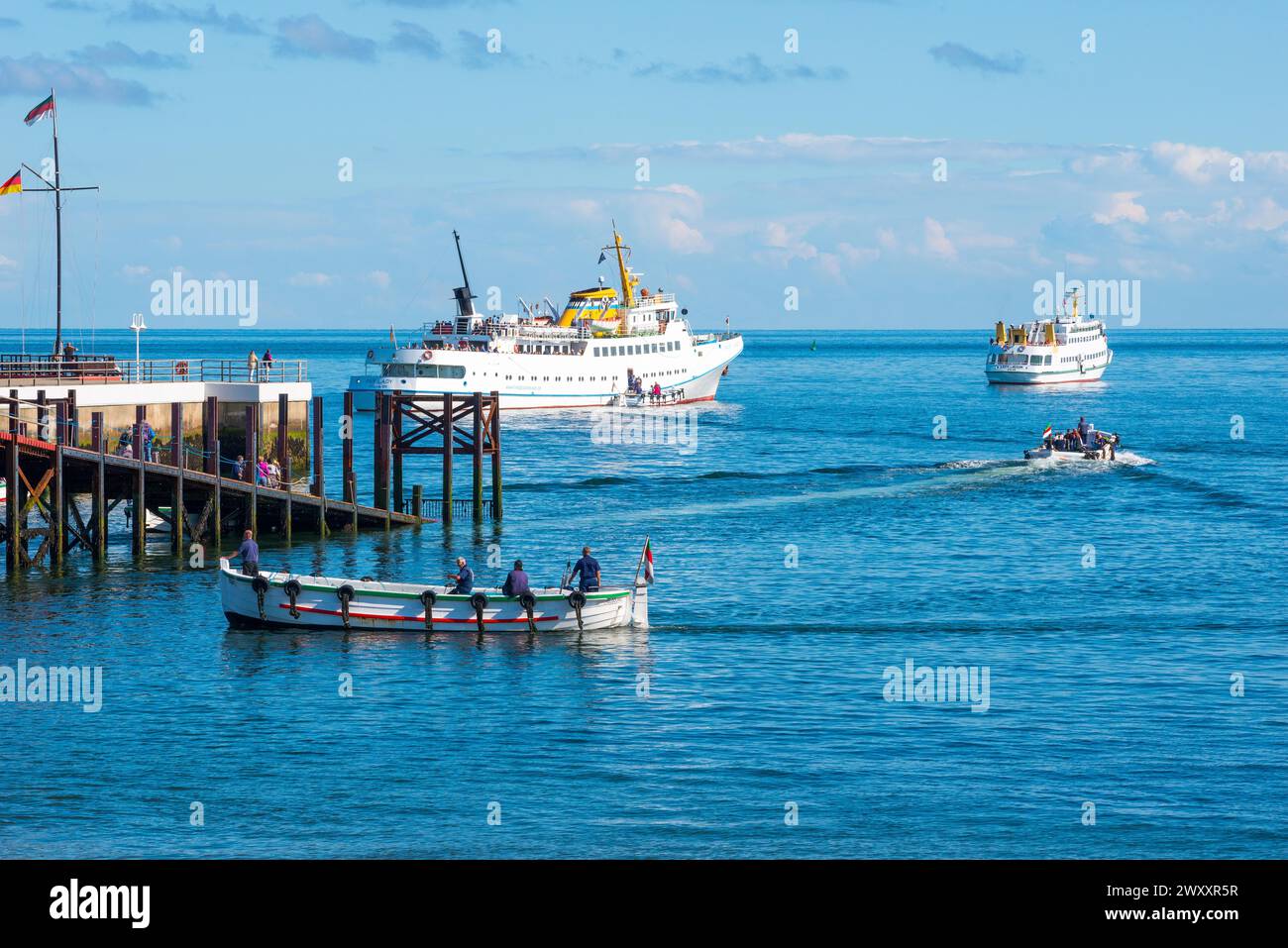 Two white ferries, 'Fair Lady' and 'Lady von Buesum', embarking ...