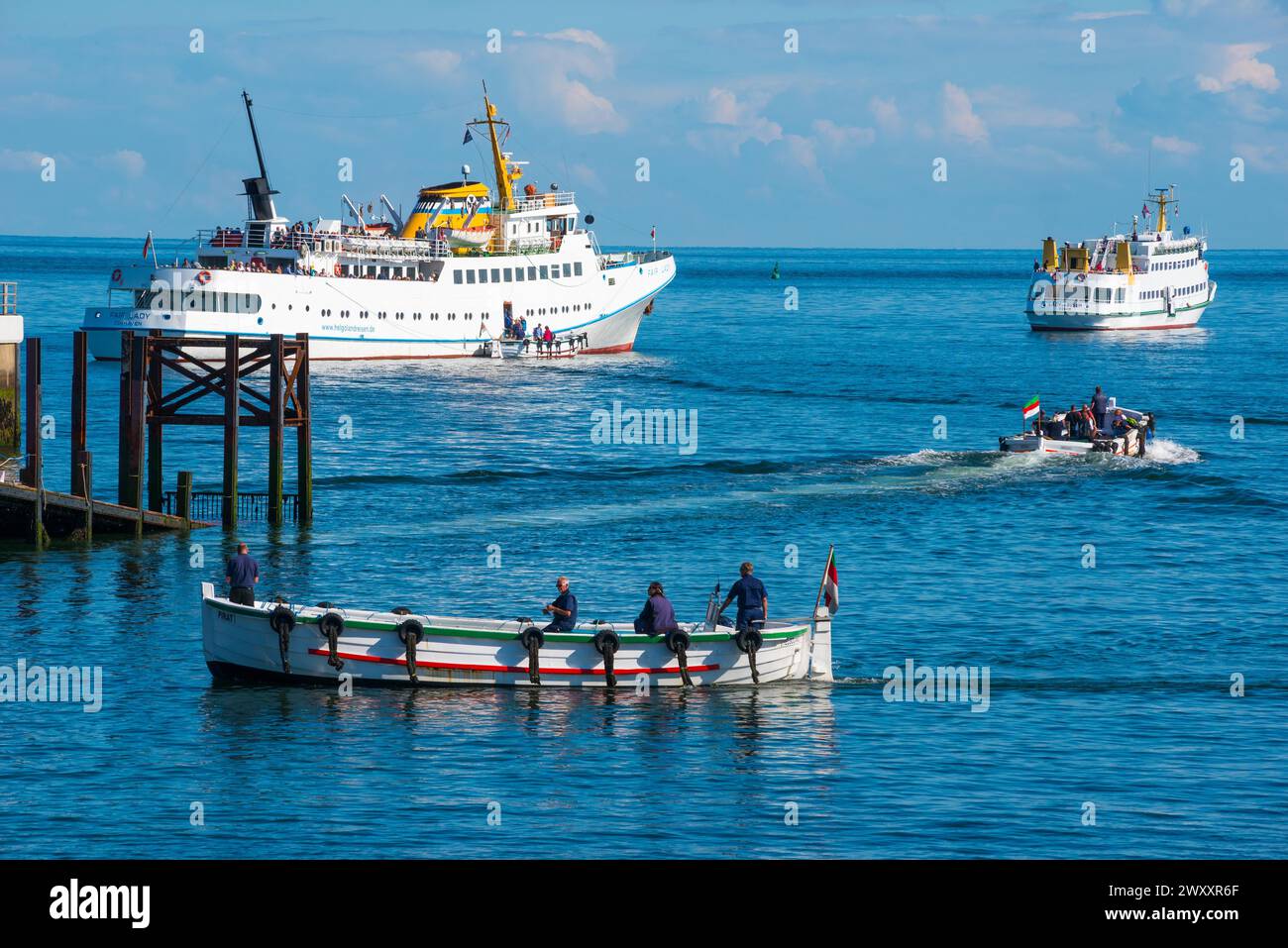 Two white ferries, 'Fair Lady' and 'Lady von Buesum', embarking ...