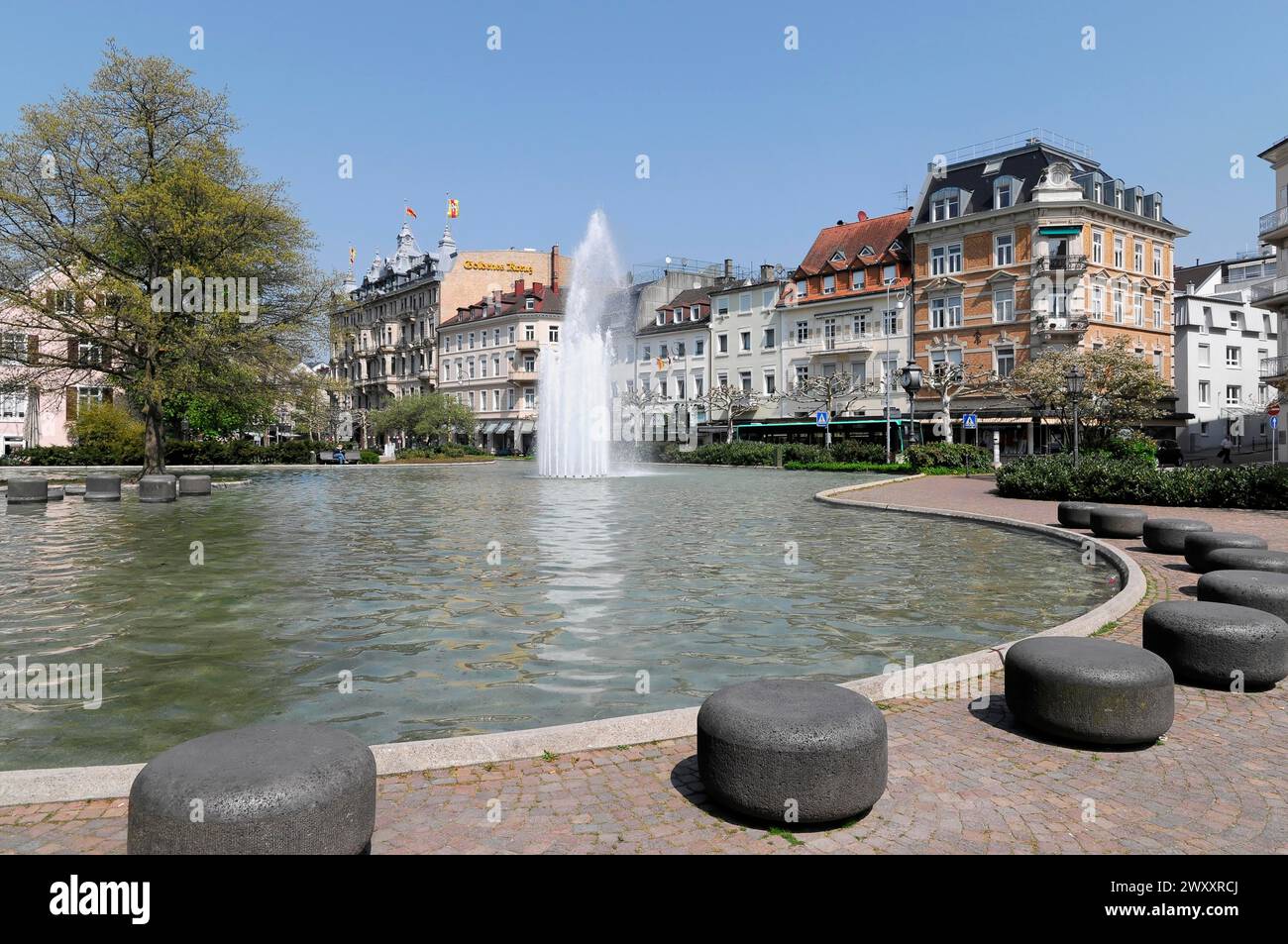 City centre of Baden-Baden, A large fountain in the middle of a pond in ...