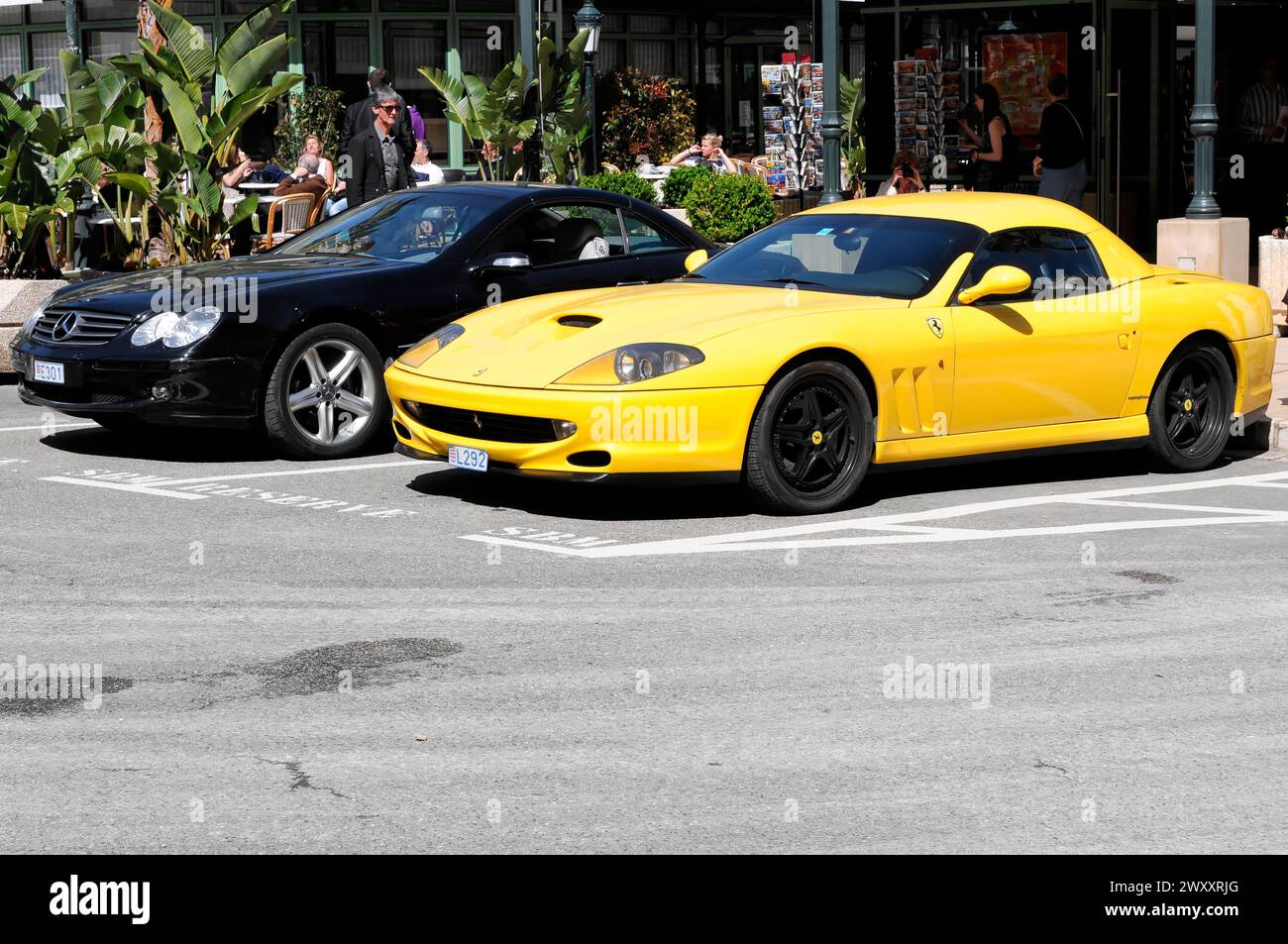 Yellow and black sports car parked on a sunny street, Monte Carlo ...
