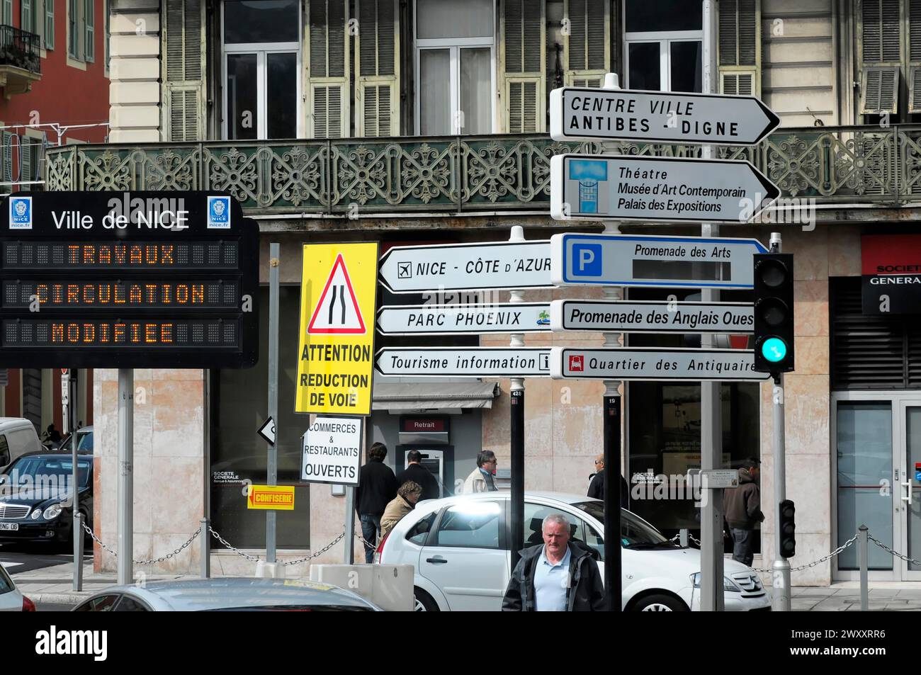 Street view with traffic signs and a pedestrian in a city, Nice, Cote d ...