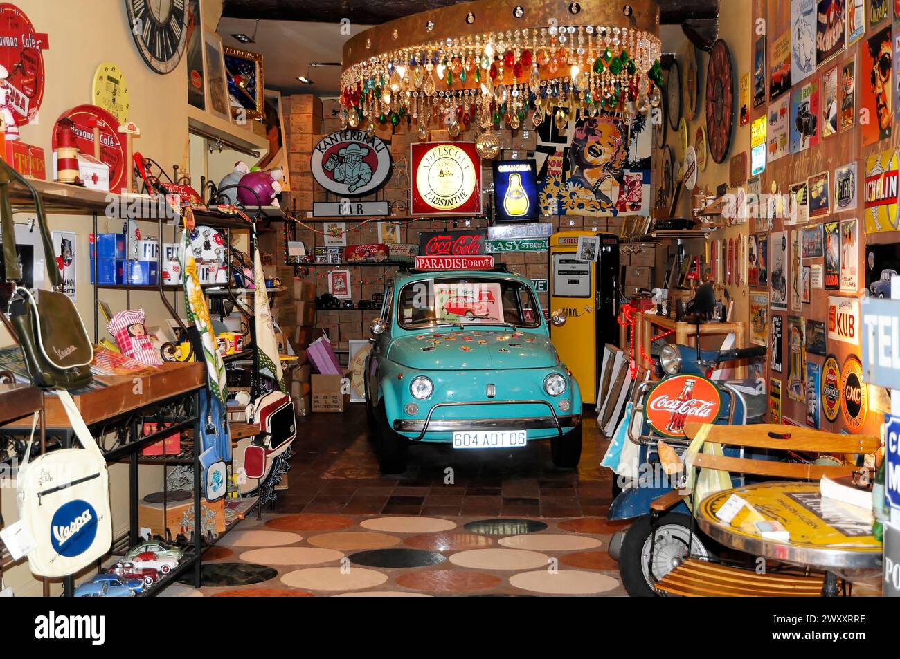 Vintage shop full of collector's items and an iconic vintage blue car ...