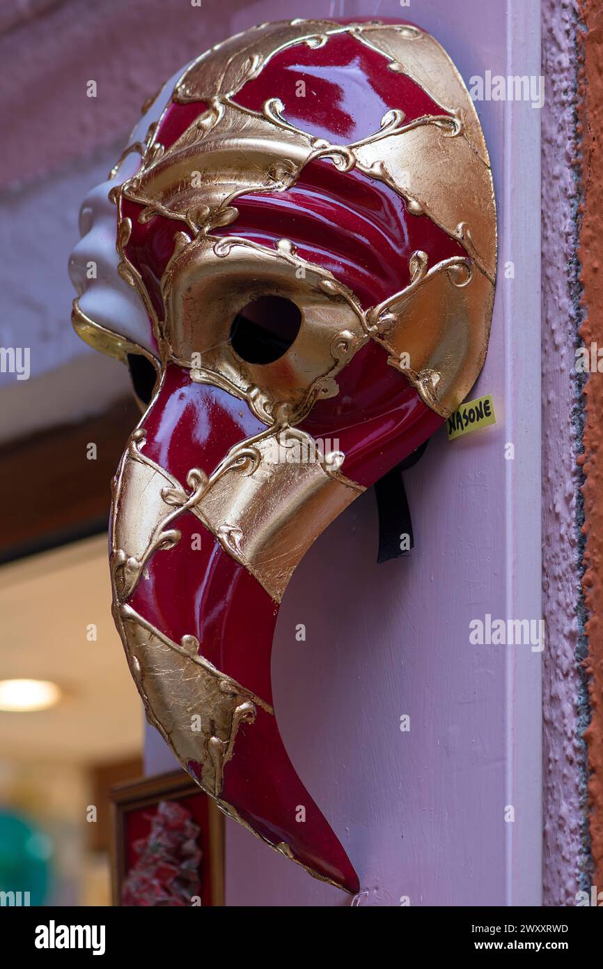 Venetian carnival mask in front of a shop, Burano, Veneto, Italy Stock ...
