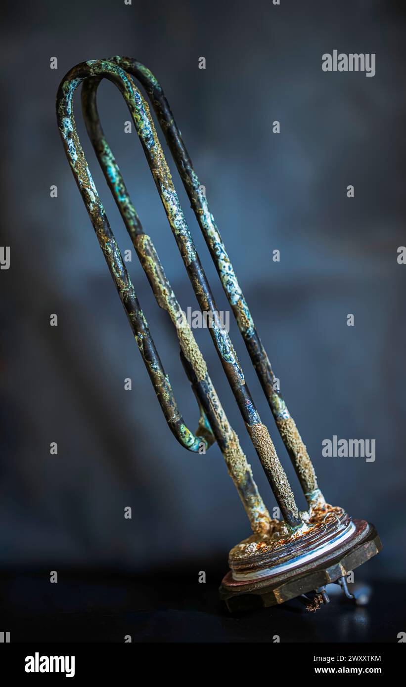 Furred element from immersion heater. An immersion heater consists of a ...