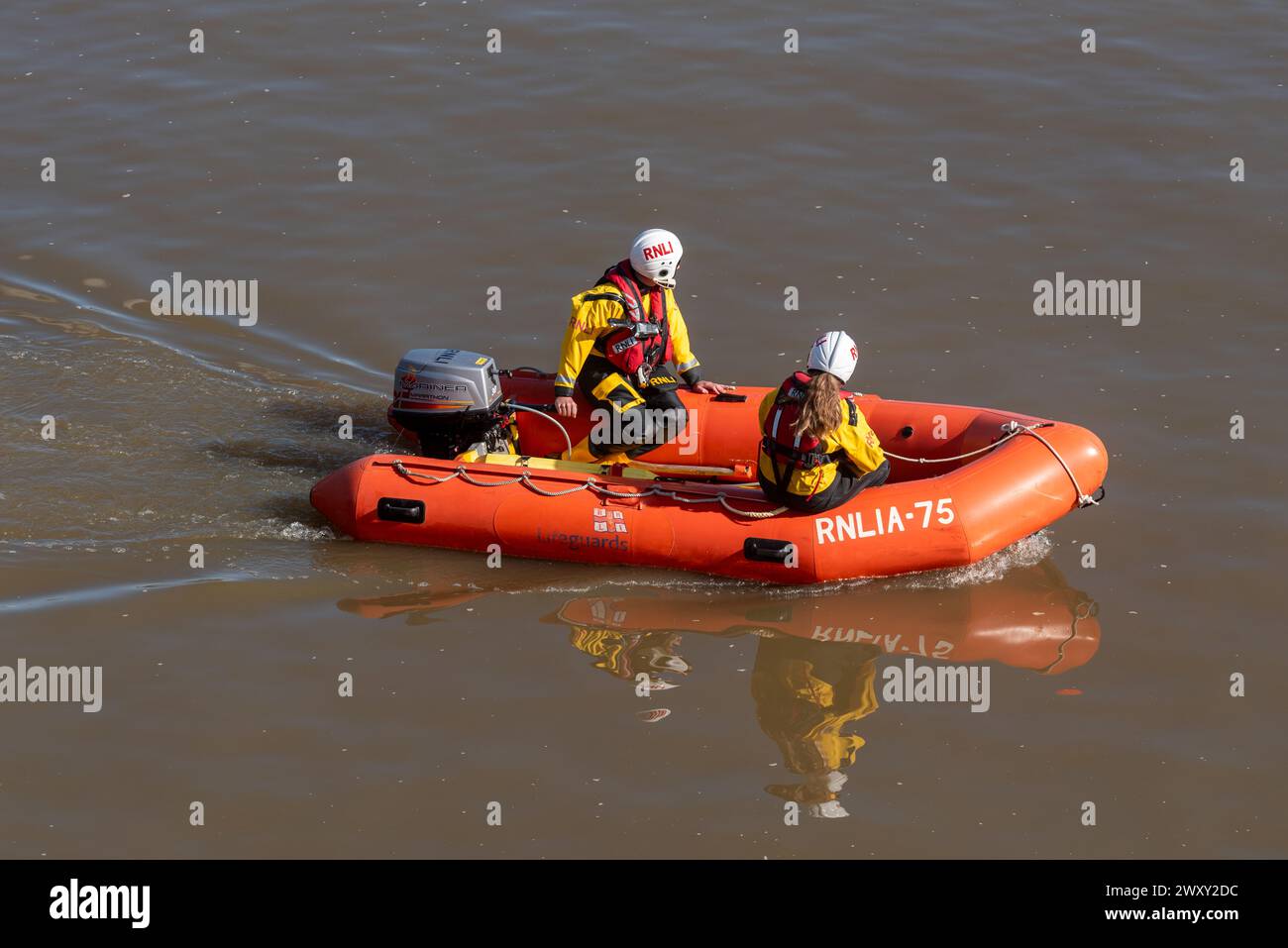 RNLI at University Boat Race on River Thames near the finish at ...