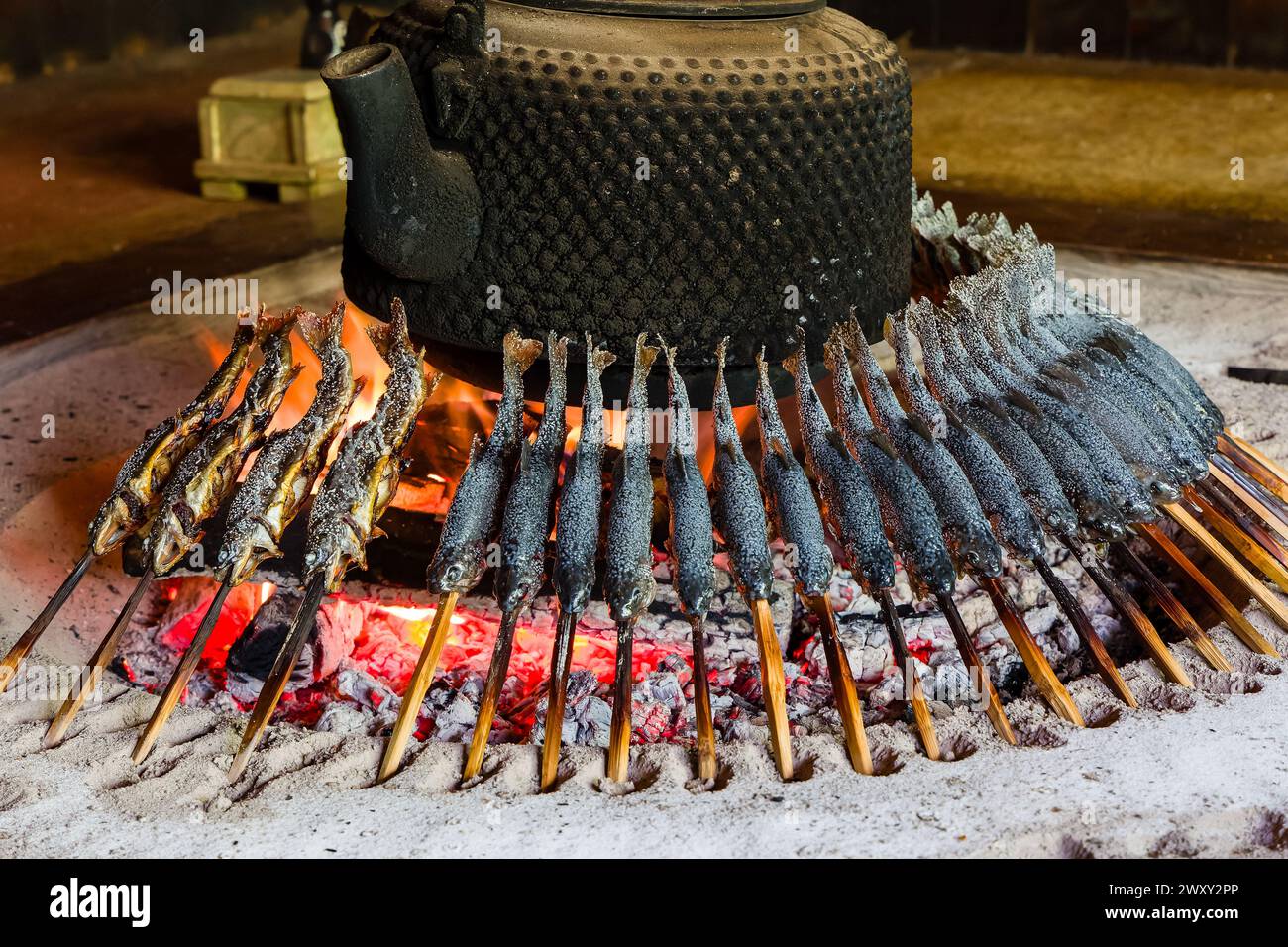 Grilled Char (Iwana) cooking on a traditional Japanese fireplace Stock ...