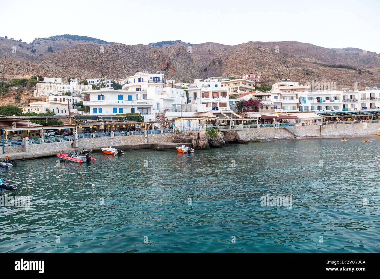 Crete island, Greece. Outdoors waterfront illuminated cafe tavern at ...