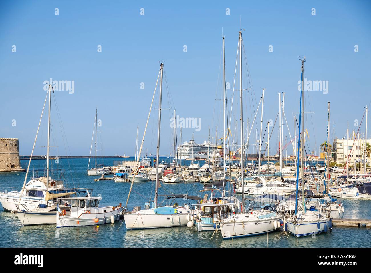 Crete island, destination Greece. Moored ship and boat with mast at ...