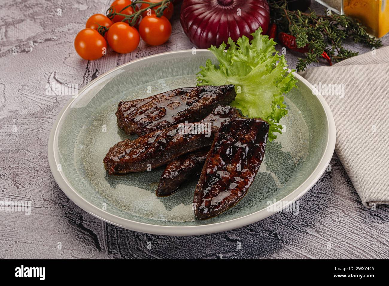 Grilled diet beef liver steak in the plate Stock Photo - Alamy