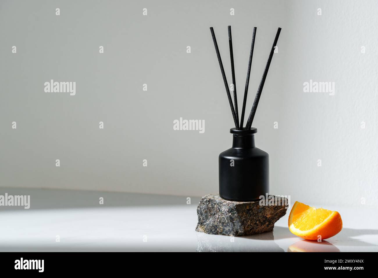 Aromatic Reed Diffuser on a Stone Base With Orange Slice Accent Stock ...
