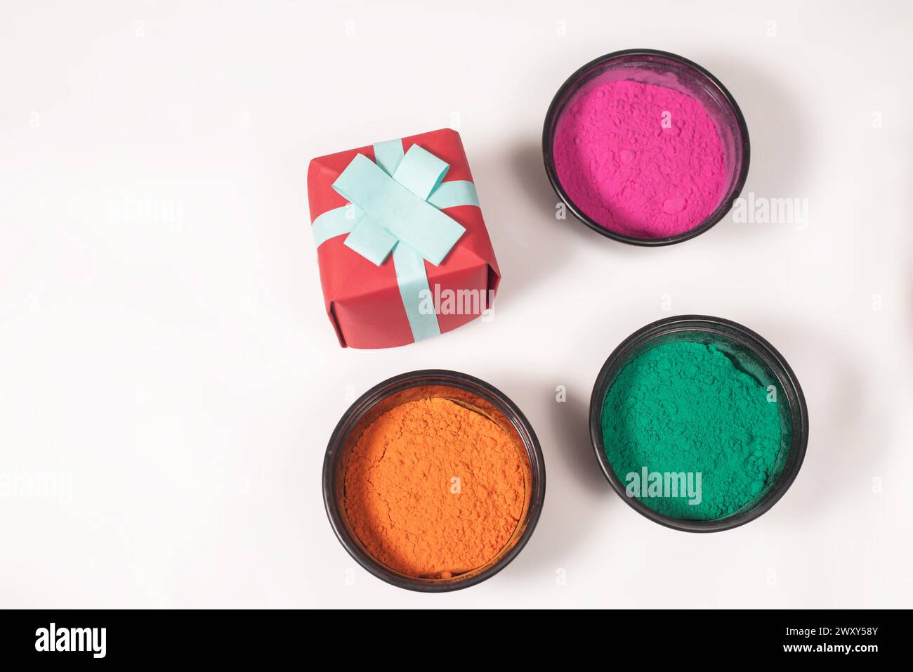 Colorful Holi powder with gift box on white background for Indian Holi ...