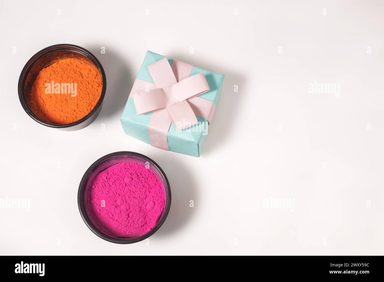 Colorful Holi powder with gift box on white background for Indian Holi ...