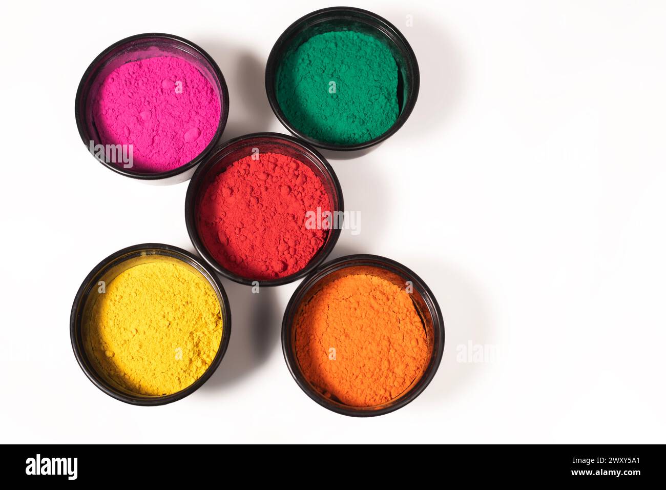 Multicolor traditional holi powder in bowl isolated on white background ...