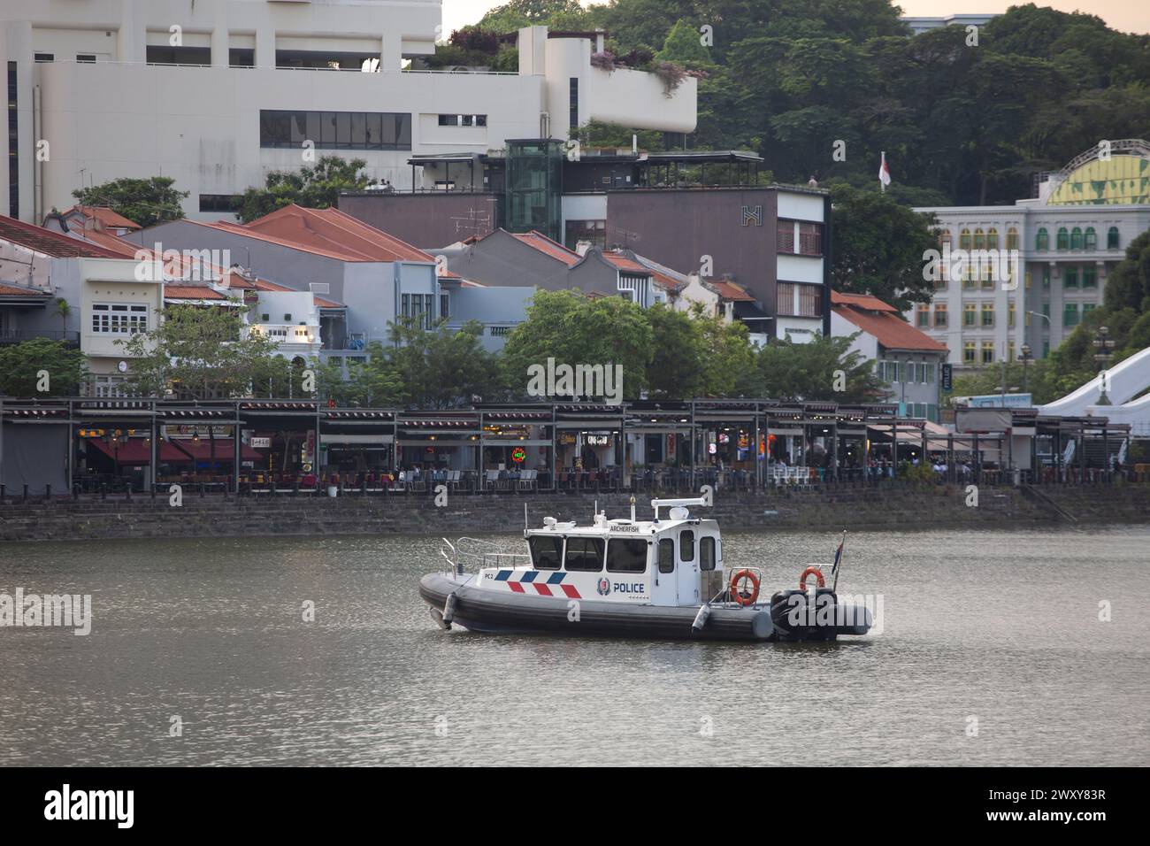 Police coast guard speedboat is patrolling at Singapore River facing ...
