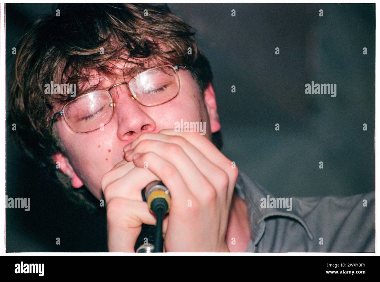 GOMEZ, EARLY CONCERT, 1998: A young Ben Ottewell of Gomez playing a ...