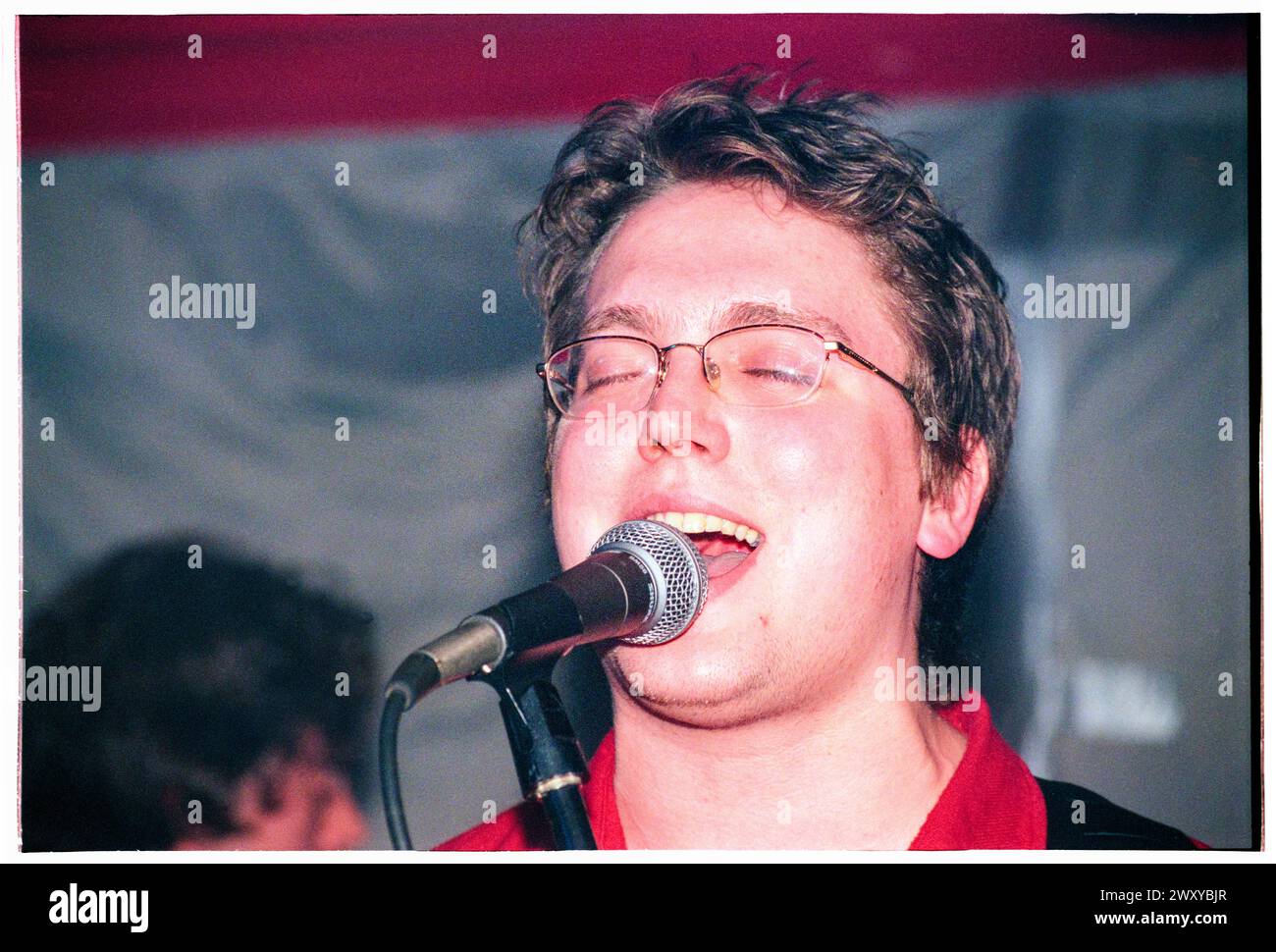 GOMEZ, EARLY CONCERT, 1998: A young A young Tom Gray of Gomez playing a ...