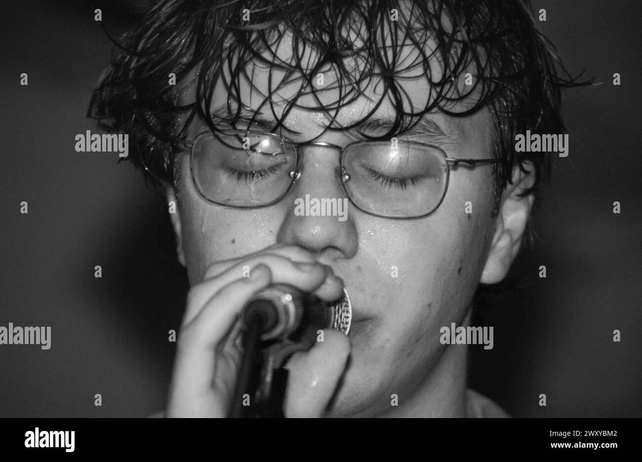 GOMEZ, EARLY CONCERT, 1998: A young Ben Ottewell of Gomez playing a ...
