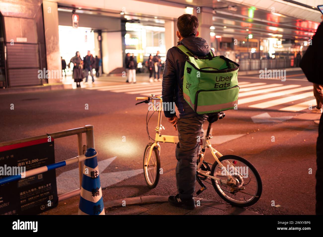 Tokyo, Japan - March 2, 2024 : Uber Eats rider delivering food at Akihabara Stock Photo - Alamy