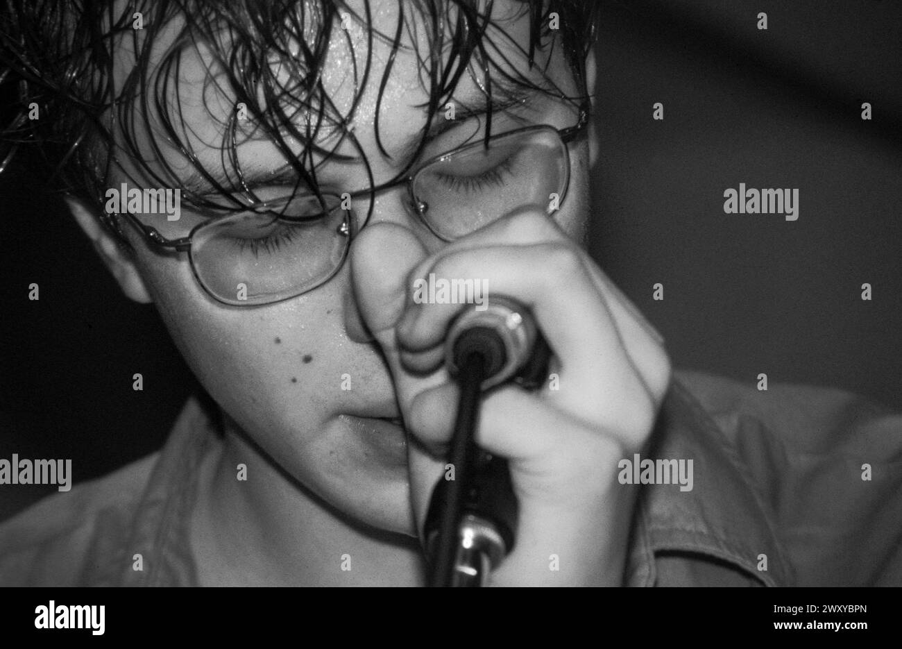 GOMEZ, EARLY CONCERT, 1998: A young Ben Ottewell of Gomez playing a ...