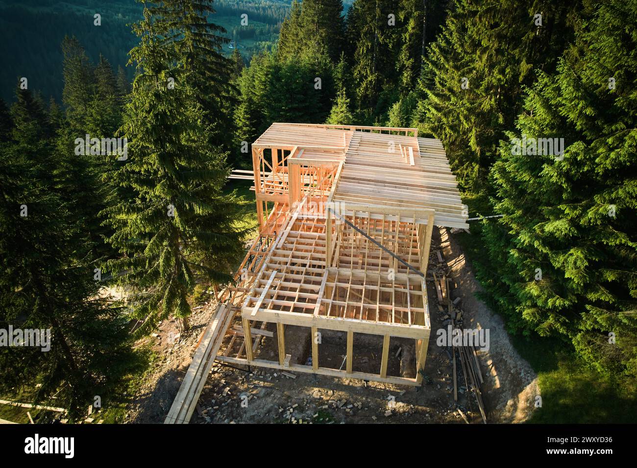 Drone view of two-story wooden frame house under construction near ...