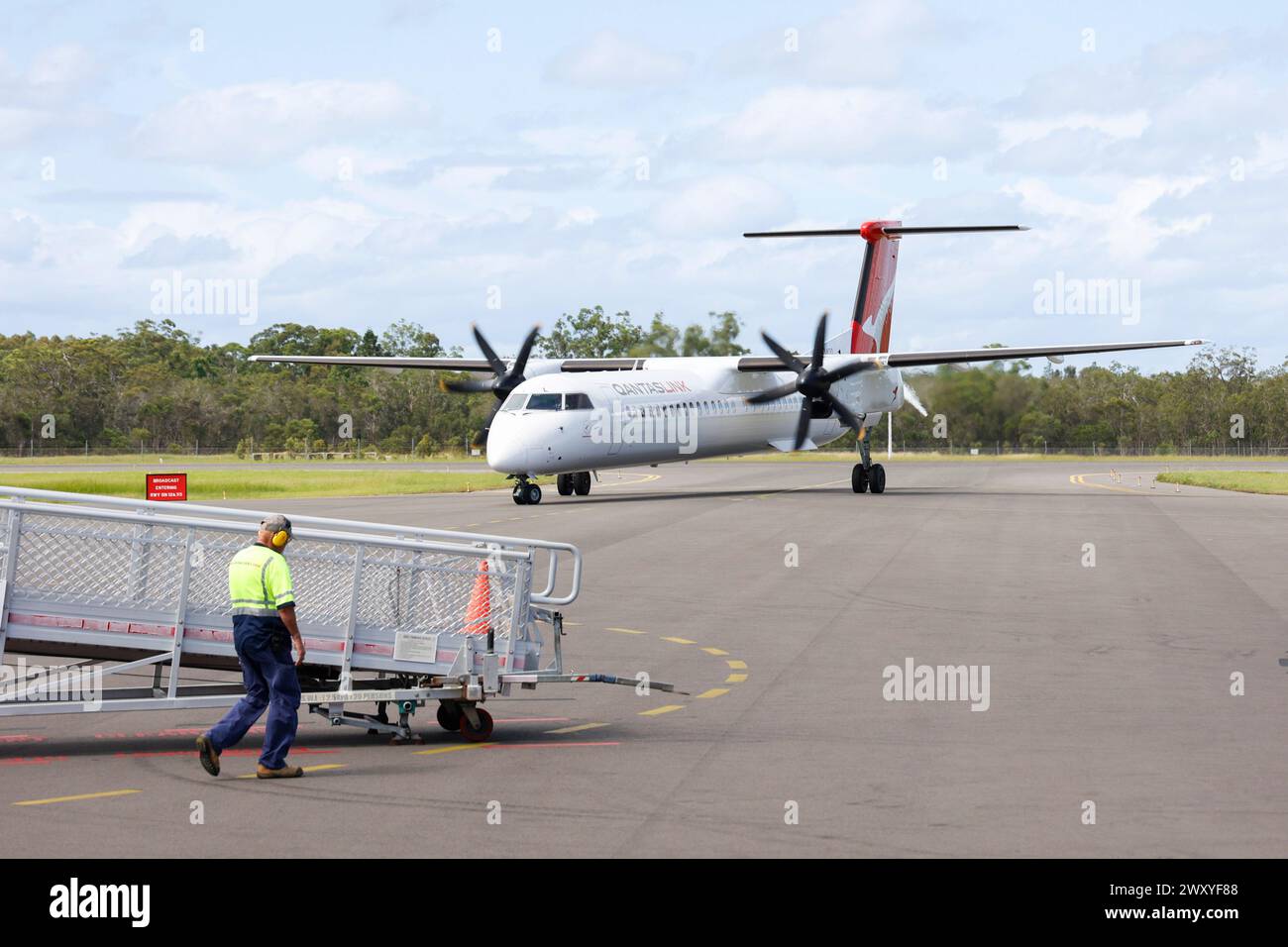 Airport ground staff preparing mobile stairs for the arriving ...