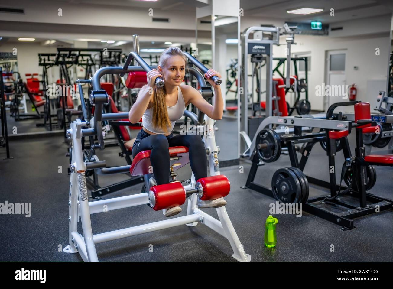 Young sport woman wearing sport wear doing exercise with fitness ...