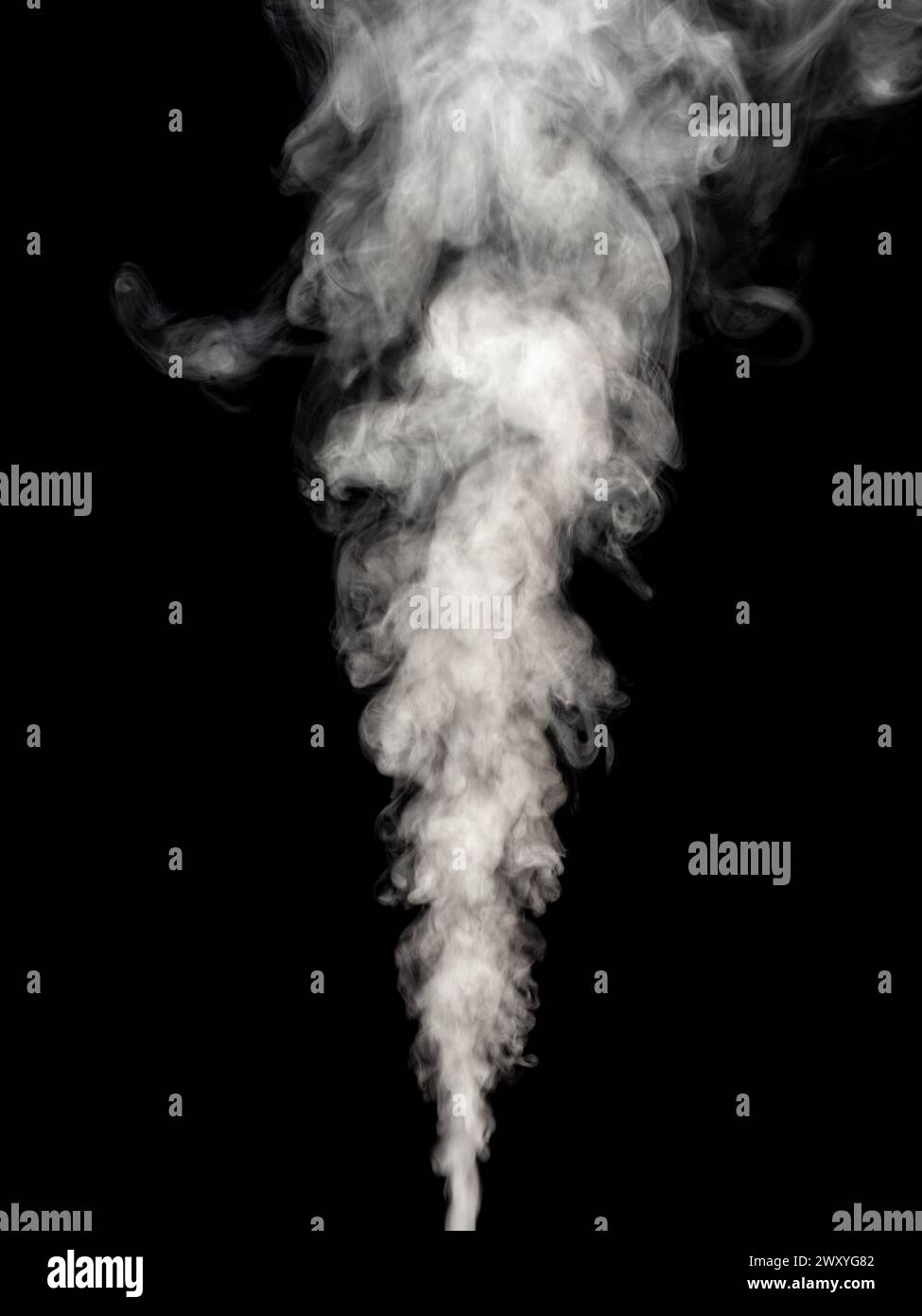 A jet of white smoke rises upward, isolated against a black background ...