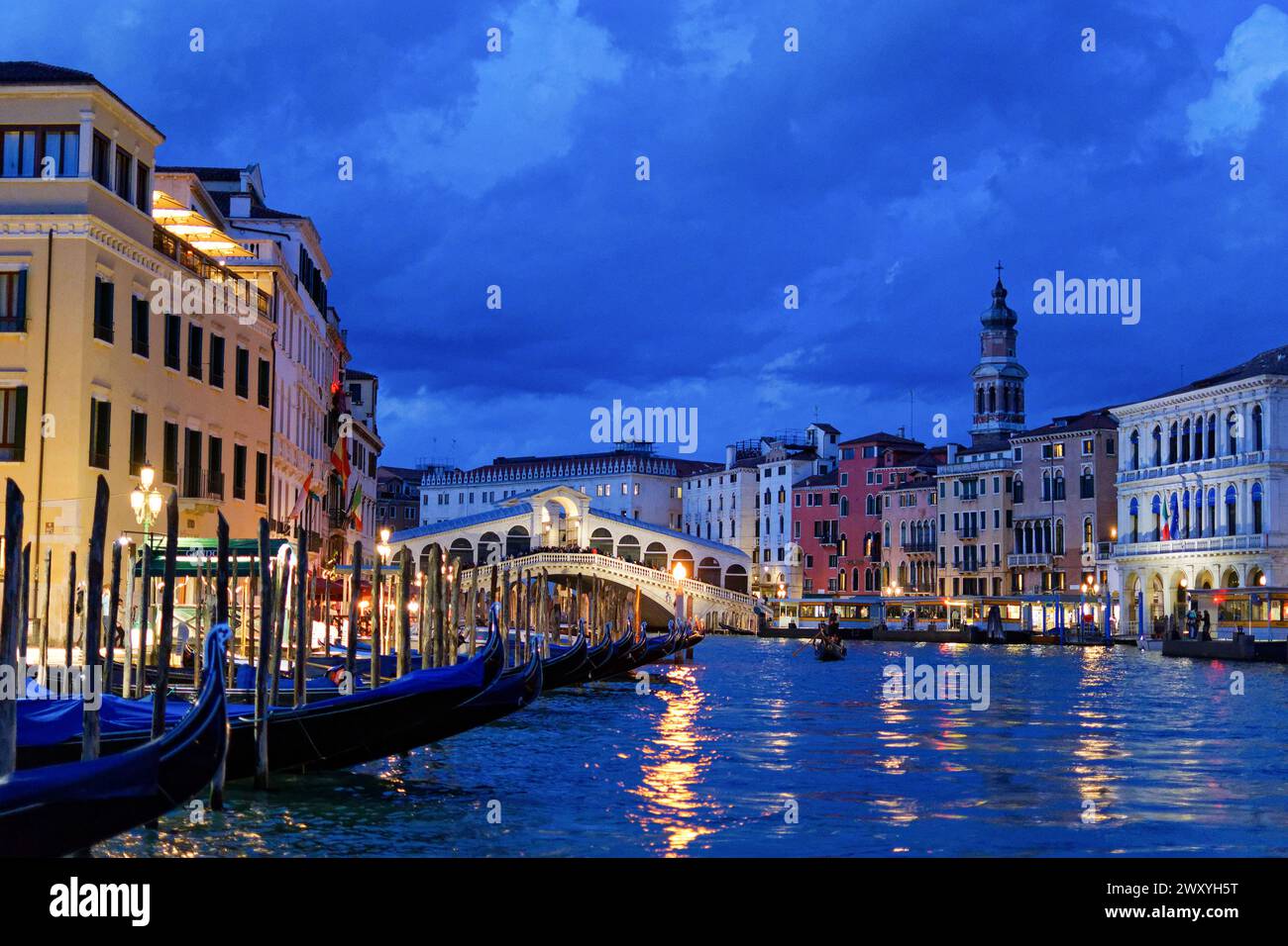Italy, Venice: the Rialto Bridge and the Grand Canal lit up at night ...