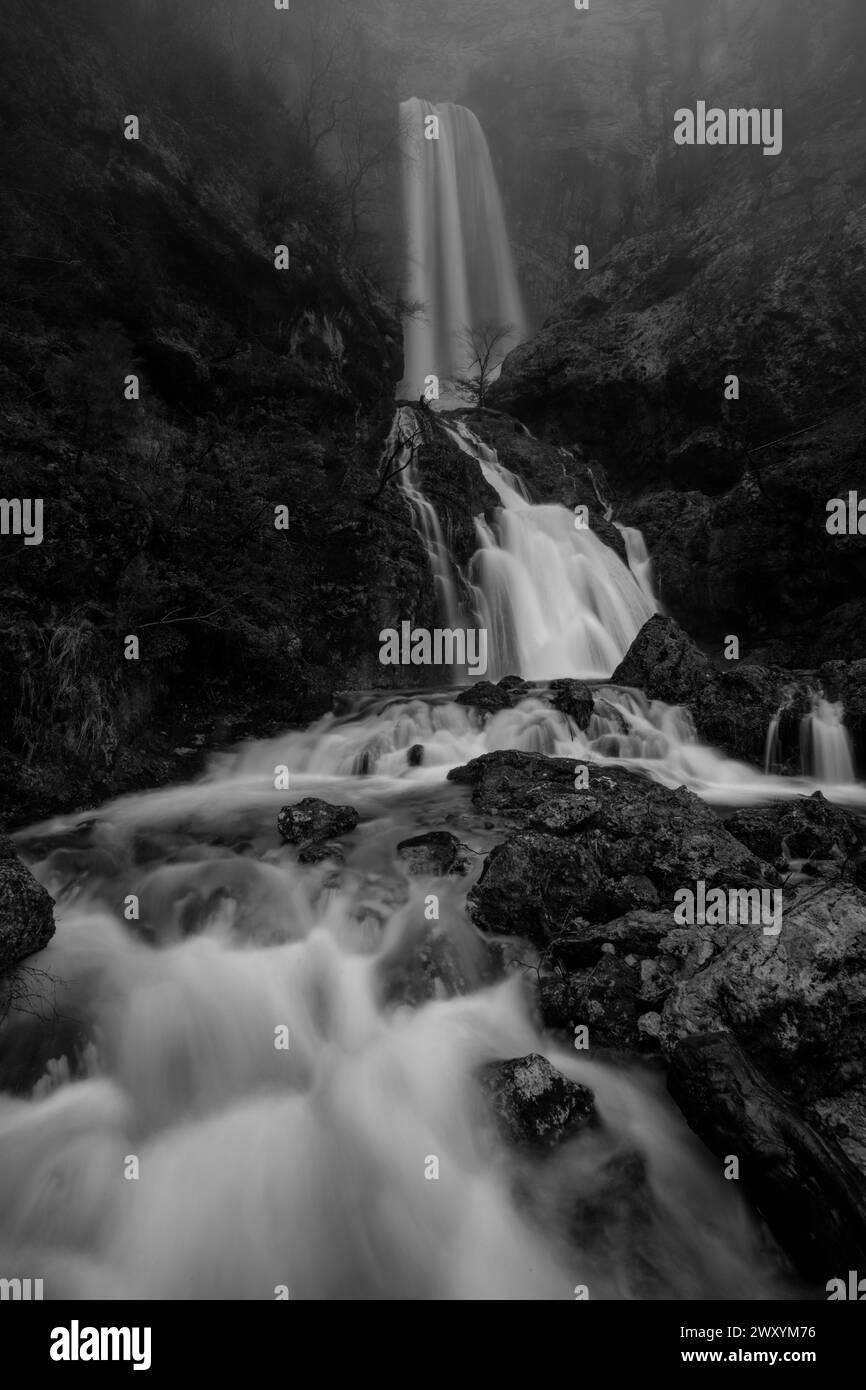 A black and white image portraying the ethereal mist of the cascading ...