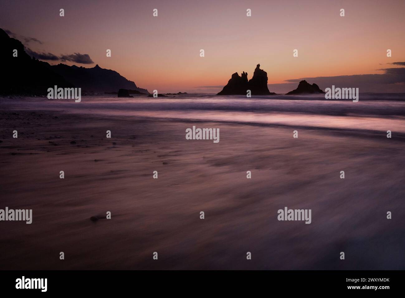 Dusky silhouettes rise from Playa de Benijo as twilight settles ...