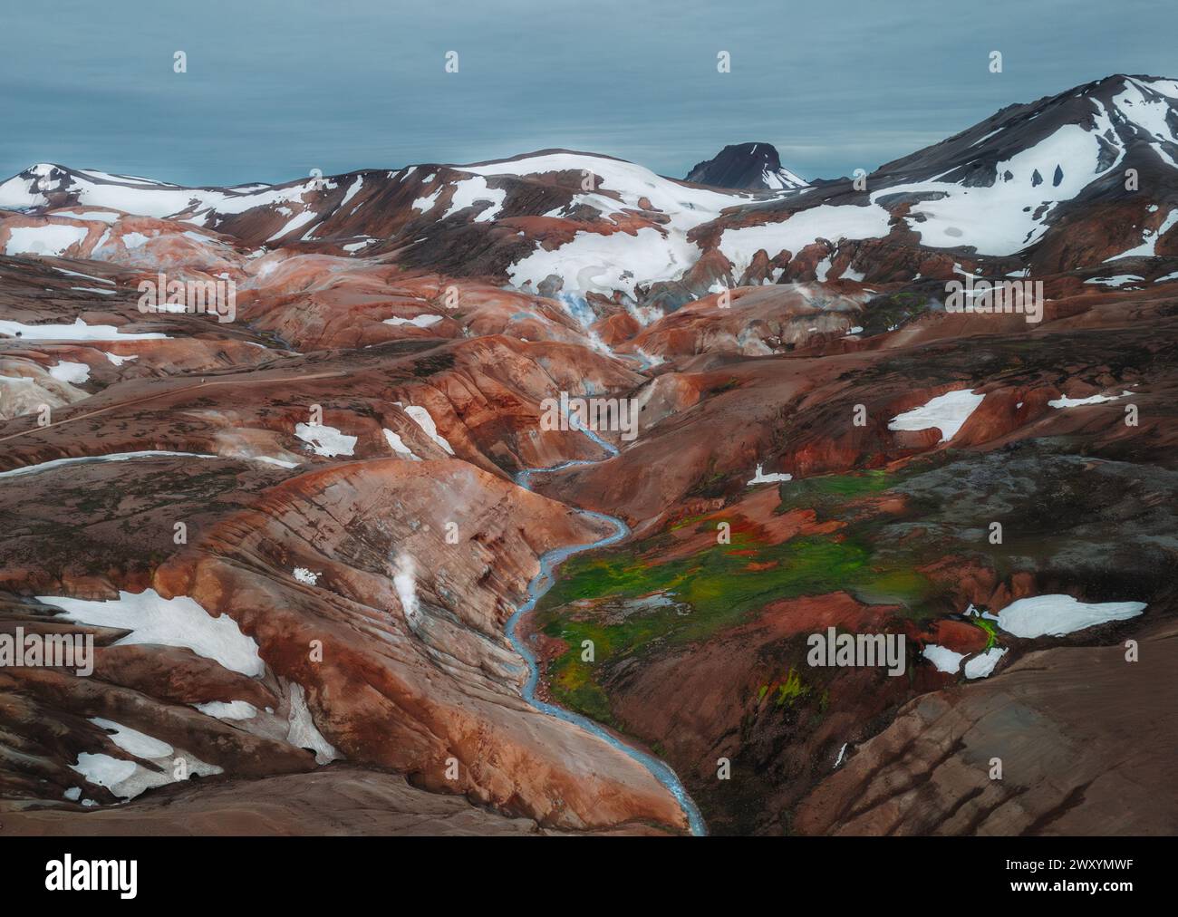 A stunning aerial view captures the vibrant hues of rhyolite mountains ...