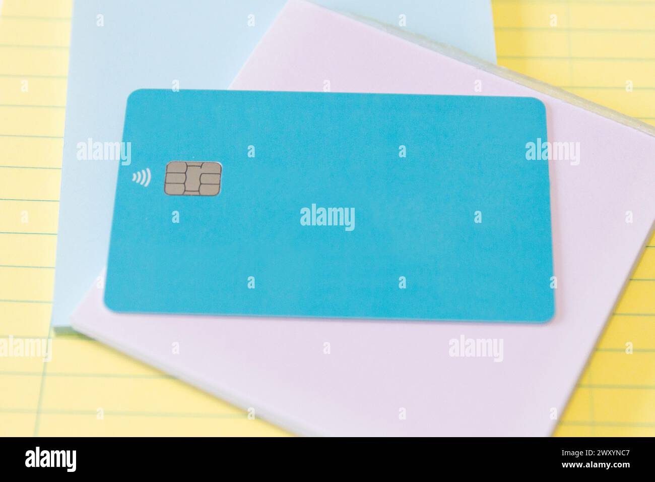 A close-up of a blue contactless payment card partially tucked inside a ...