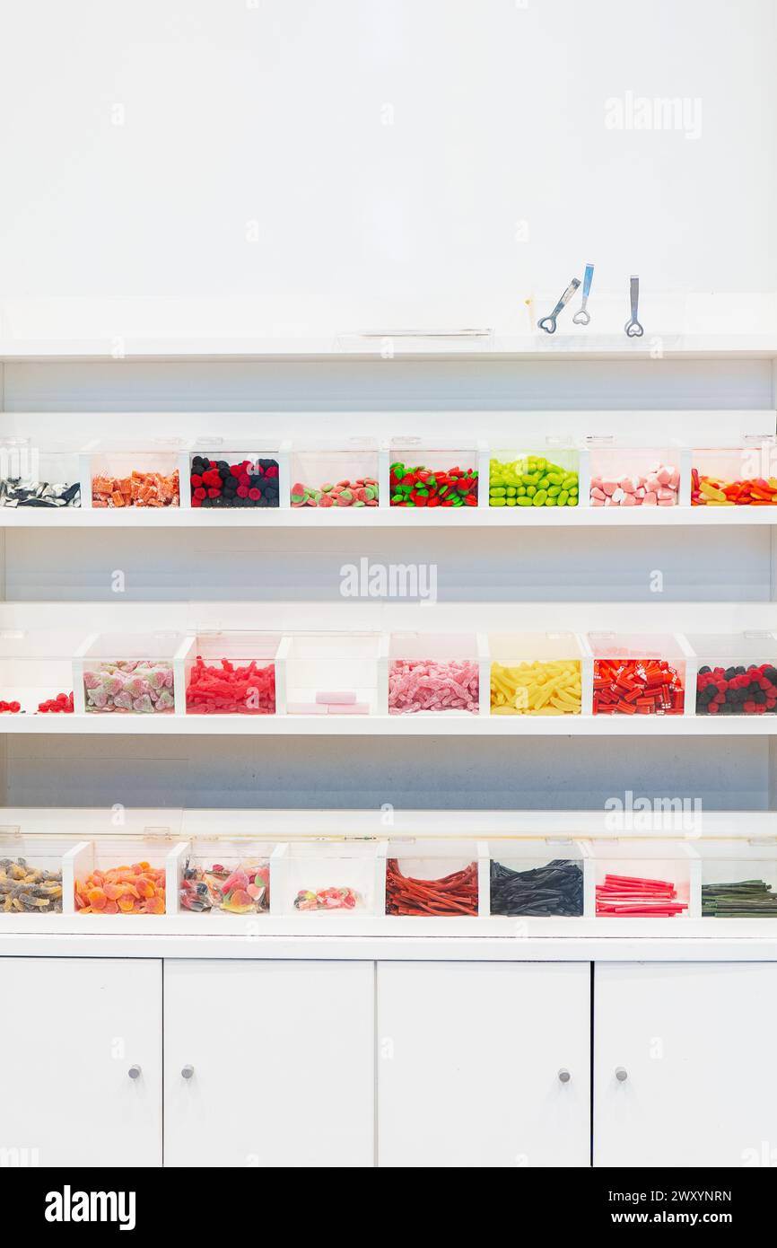 A well-organized candy shop interior with assorted candies sorted in ...