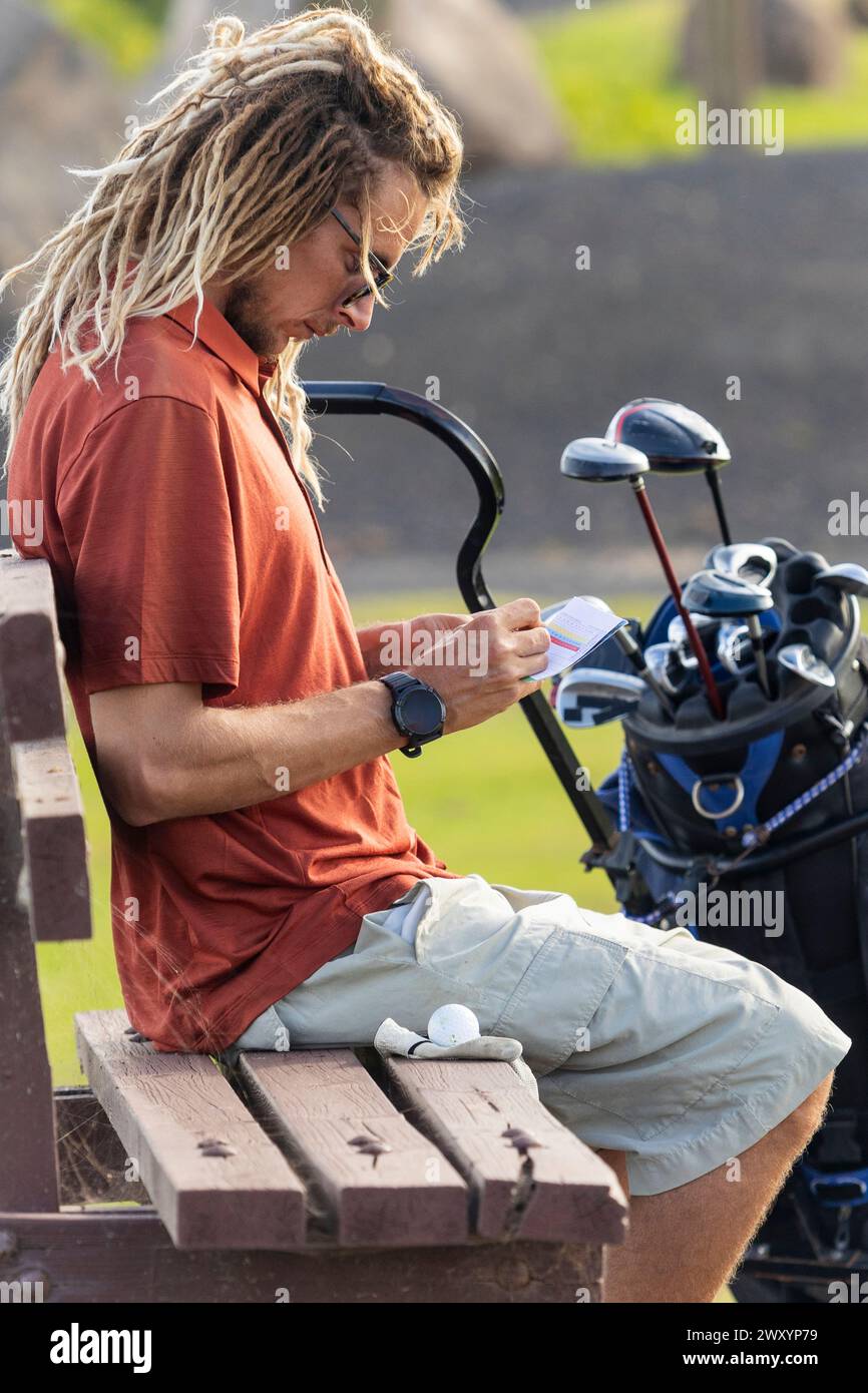 Golf ball sitting on tee hi-res stock photography and images - Alamy