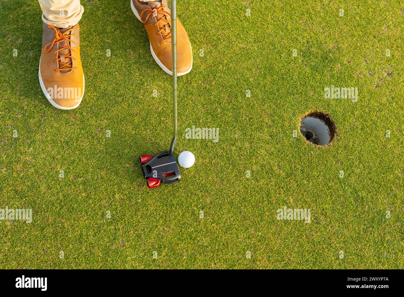 From above cropped unrecognizable golfer, sporting a unique pair of ...